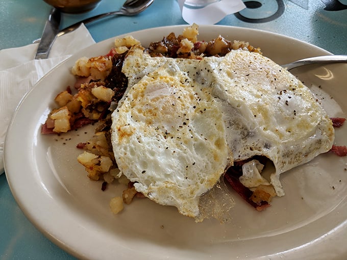 Sunny-side perfection meets crispy corned beef hash. Those eggs look like they're having a better morning than most of us!