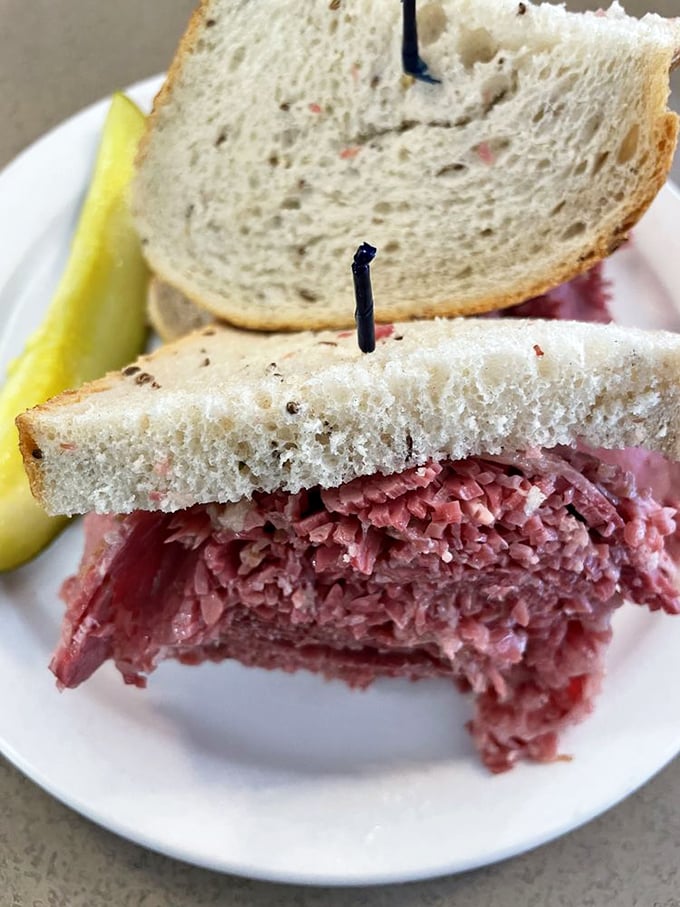 Behold the star of the show—thinly sliced corned beef stacked so high it practically needs its own zip code.