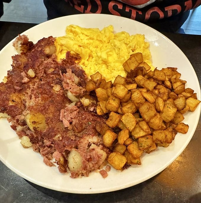 Corned beef hash that doesn't mess around—crispy, savory, and paired with eggs and potatoes that make hitting snooze seem like a crime.