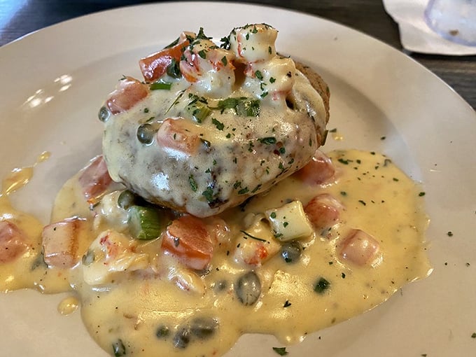 Behold the crab cake that launched a thousand road trips – swimming in a buttery sauce that you'll be tempted to drink when nobody's looking.