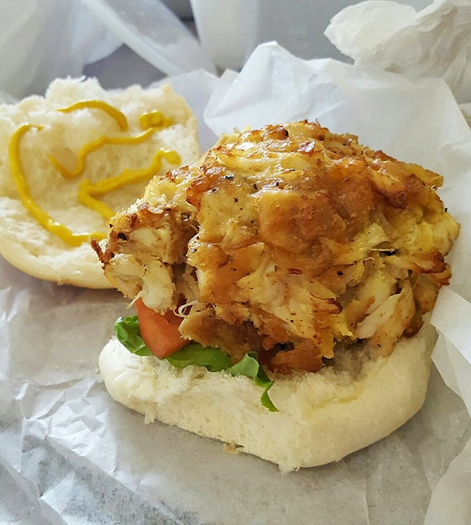 Behold the holy grail of crab cakes—golden-crusted, barely bound together by kitchen magic. This sandwich doesn't need fancy plating to change your life.