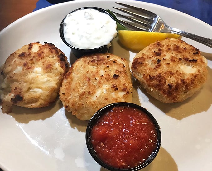 These golden-brown crab cakes are what seafood dreams are made of—more crab than cake, served with the kind of sauce that makes you consider drinking it directly.