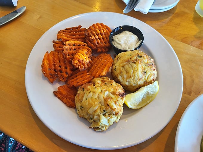 Behold the stars of the show: golden-brown crab cakes with sweet potato waffle fries – Maryland's answer to "What is happiness?"