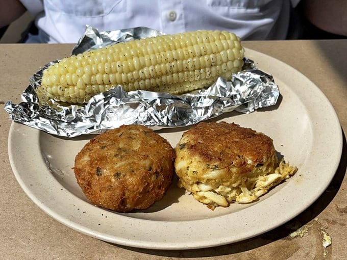 Golden-brown perfection meets sweet corn on the cob—these crab cakes contain so little filler, they practically need their own fishing license.