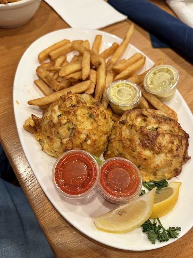 The main event: golden-brown crab cakes with minimal filler, maximum flavor. These aren't just crab cakes—they're edible Maryland souvenirs that locals treasure too.
