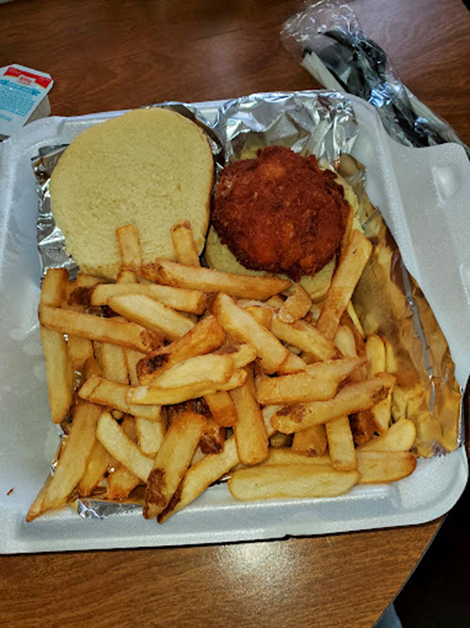 This isn't just a crab cake sandwich – it's Maryland's soul on a bun, golden-brown and packed with more crab than binding.