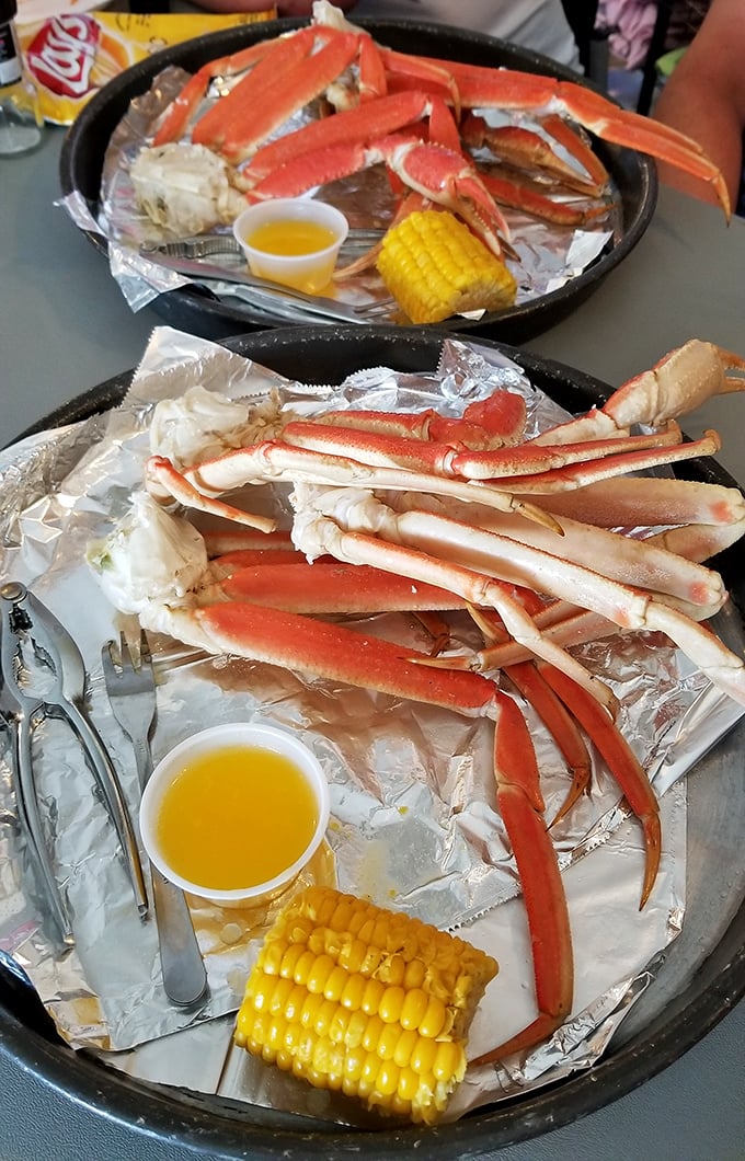 These crab legs aren't just dinner, they're an event – sweet meat waiting to be liberated from their crimson shells alongside buttery corn on the cob.