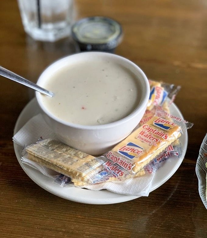 The legendary crab stew arrives with crackers for dunking – creamy, rich, and packed with sweet crab meat that makes conversation stop mid-sentence.