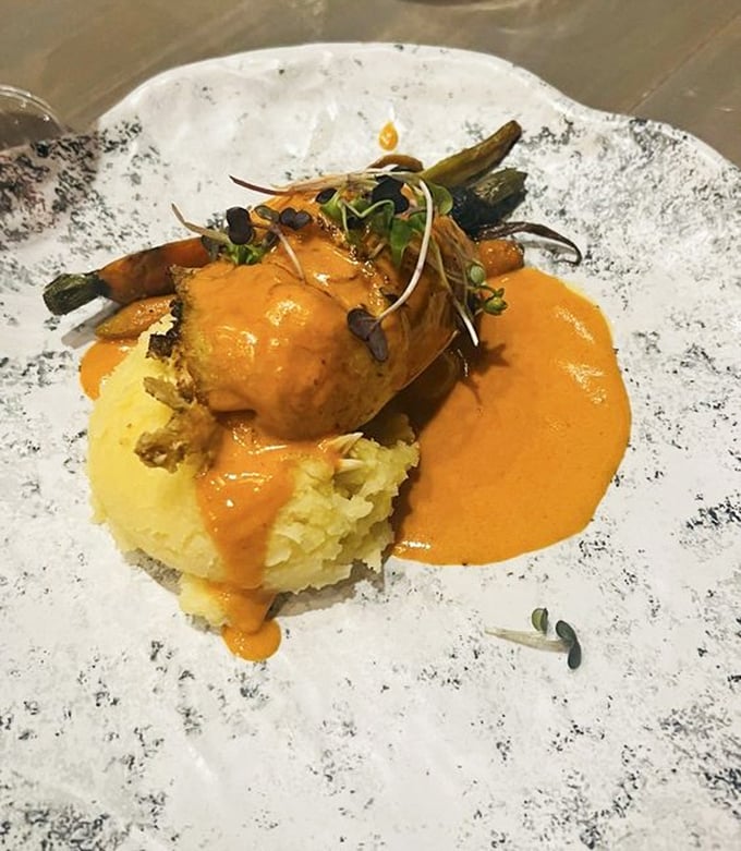 This isn't just dinner, it's edible art. The crab-stuffed flounder rests on a cloud of whipped potatoes, surrounded by a sauce so good you'll want to bathe in it.