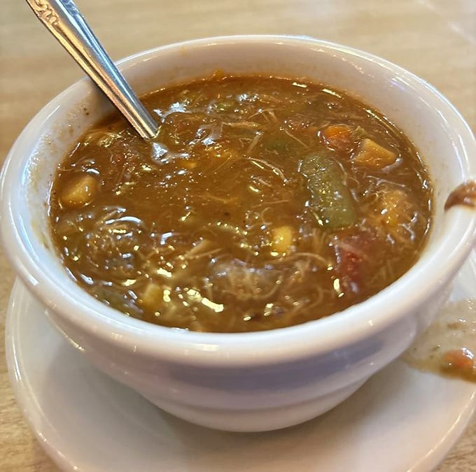 Maryland crab soup that's worth crossing state lines for—chunks of sweet crab meat swimming in a tomato broth that whispers secrets of the Chesapeake.