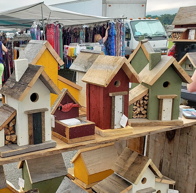 Charming birdhouses in a rainbow of colors stand at attention. These whimsical wooden homes might make even your neighborhood cardinals consider upgrading.