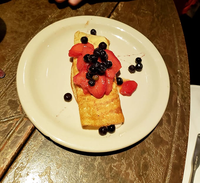 This delicate crepe with fresh strawberries and blueberries proves that Italians understand dessert isn't just a course—it's a love language.