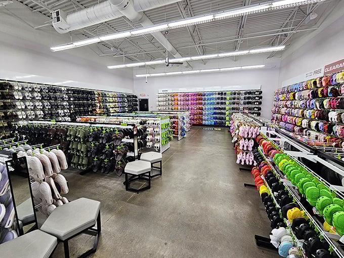 A rainbow explosion of Crocs—where comfort meets questionable fashion choices that somehow became cool again. Resistance is futile.