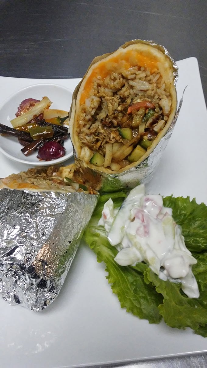 Behold the star attraction: a curry chicken burrito that brilliantly marries Sri Lankan spices with Texan portion expectations, wrapped in foil-clad perfection.