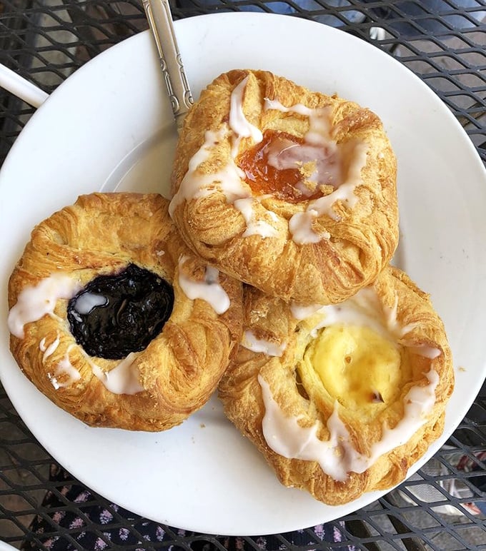 These Danish pastries aren't just breakfast, they're edible art—flaky, buttery sculptures filled with fruit that somehow make Monday mornings bearable.