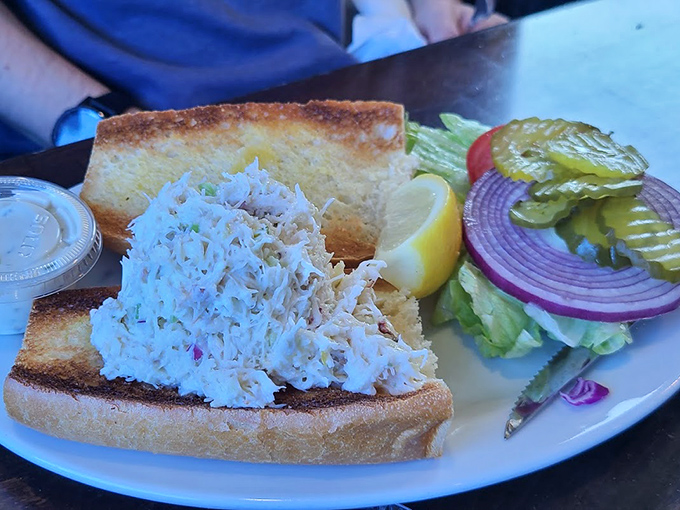 The crown jewel: Barbara's Dungeness crab sandwich showcases sweet, delicate meat piled high on toasted bread—simplicity that lets the ocean's bounty shine.