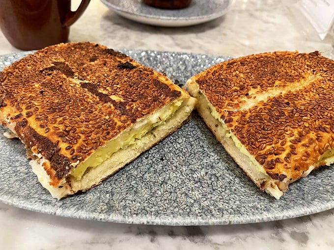 This Jerusalem bagel sandwich isn't just breakfast, it's an epiphany – sesame-crusted perfection cradling eggs and cheese with za'atar's aromatic embrace.