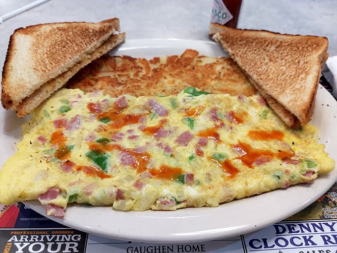 The legendary Farmers Omelet in all its glory—a perfect marriage of fluffy eggs, colorful vegetables, and melty cheese. Breakfast architecture at its finest.
