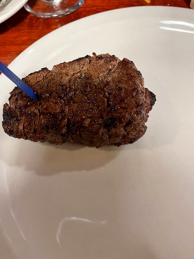 This isn't just a steak—it's a masterpiece of meat. The perfect crust seals in juices that would make even the most composed carnivore weak at the knees.
