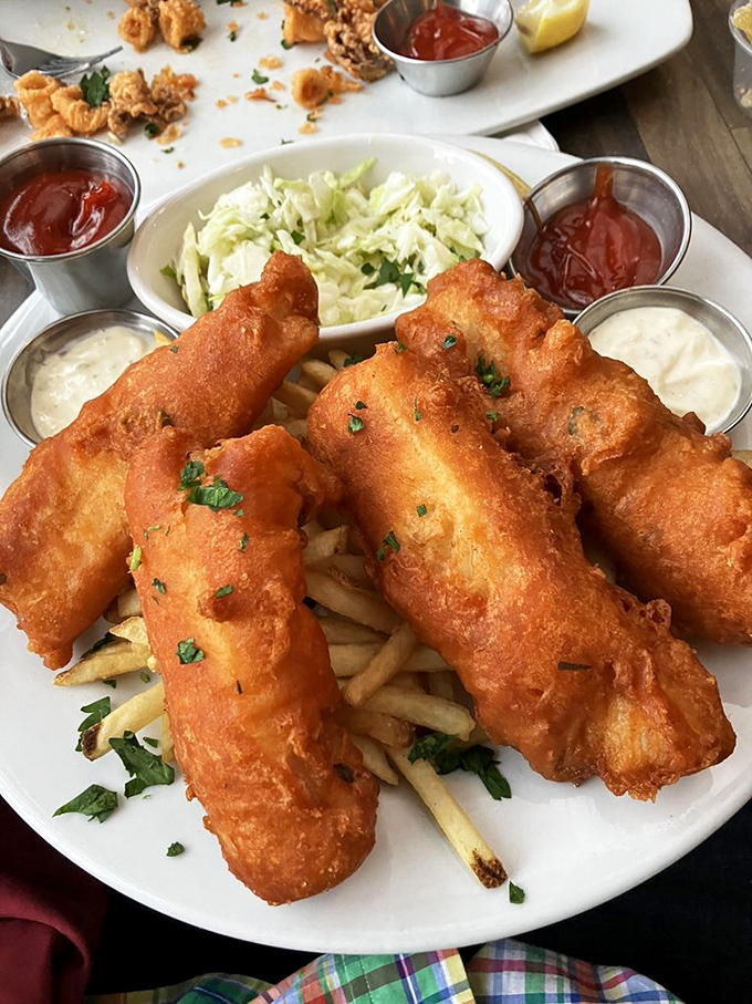 Golden, crispy, perfect—these fish and chips aren't just food, they're edible sunshine. The accompanying sauces are like backup singers who could be stars themselves.