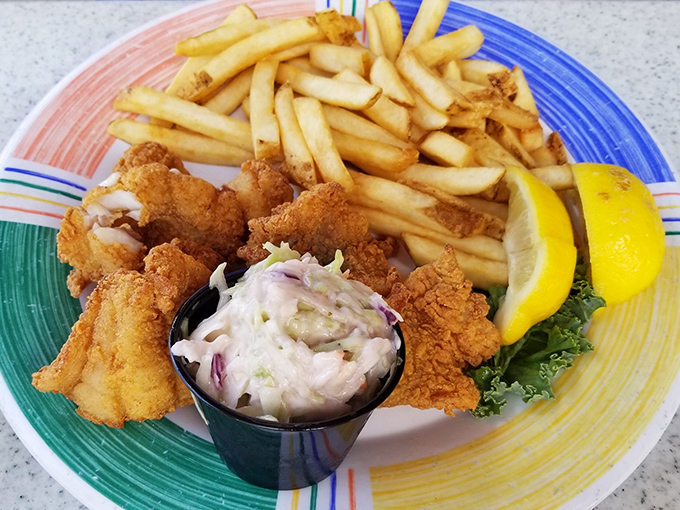 Behold the golden glory – fish and chips that make British pubs weep with envy, served with Florida sunshine.