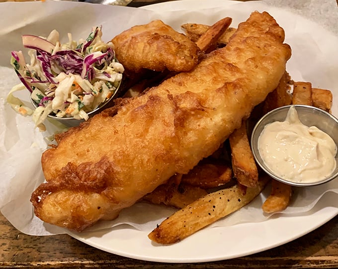 Golden, crispy, and substantial enough to require a building permit – this fish and chips comes with slaw that isn't an afterthought but a worthy companion.