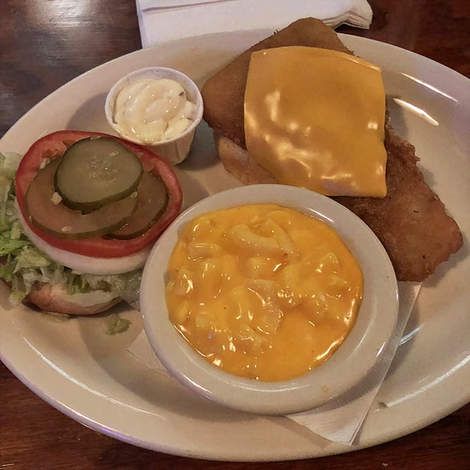 This isn't just a fish sandwich; it's a golden-battered masterpiece with melty cheese and mac salad that would make coastal seafood joints jealous.