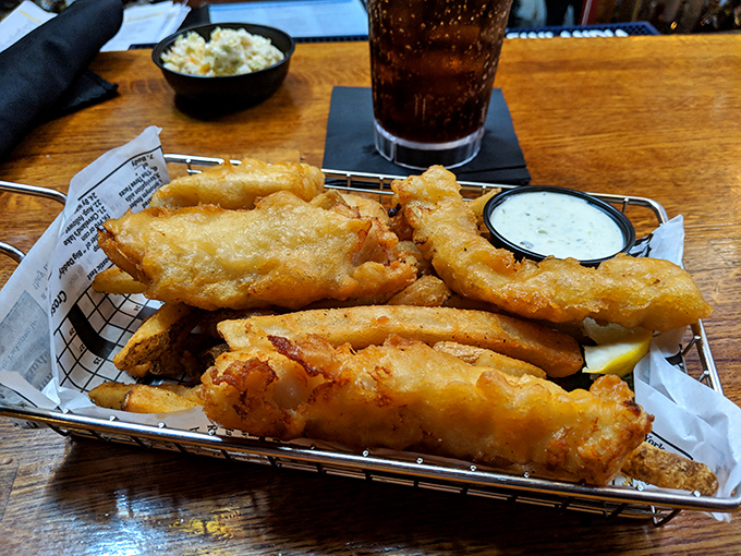 Golden, crispy perfection—Cooper's legendary fish and chips arrive in a wire basket like treasure from the deep.