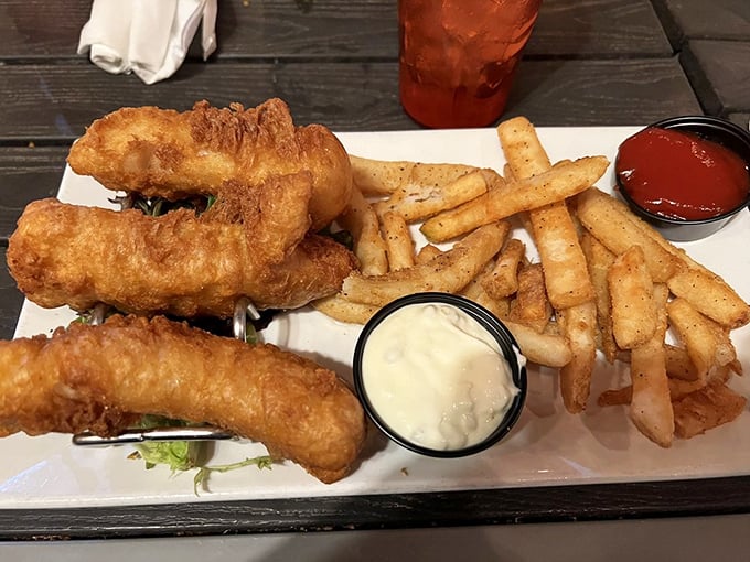 Golden-battered fish that shatters with each bite, paired with fries that somehow stay crispy even in Florida humidity. This is seafood nirvana.