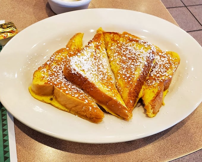 French toast that's achieved celebrity status in my carb dreams—golden, crispy edges giving way to custardy centers dusted with powdered sugar.
