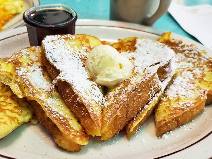 French toast that makes pancakes jealous. That melting butter pat is performing a slow dance of deliciousness that deserves a standing ovation.