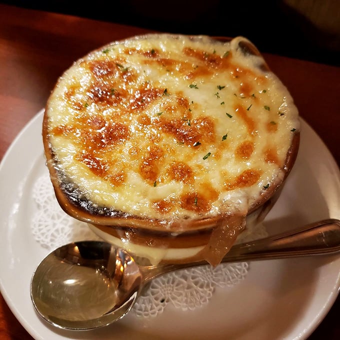 French onion soup that's achieved the perfect cheese-pull-to-broth ratio. That golden crown of bubbling cheese is practically begging for a bread dunk.
