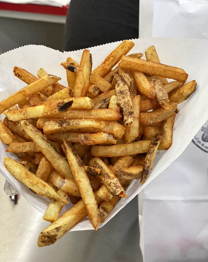 These hand-cut fries aren't just a side dish—they're the co-stars of the show, with crispy exteriors and fluffy insides that put frozen imposters to shame.