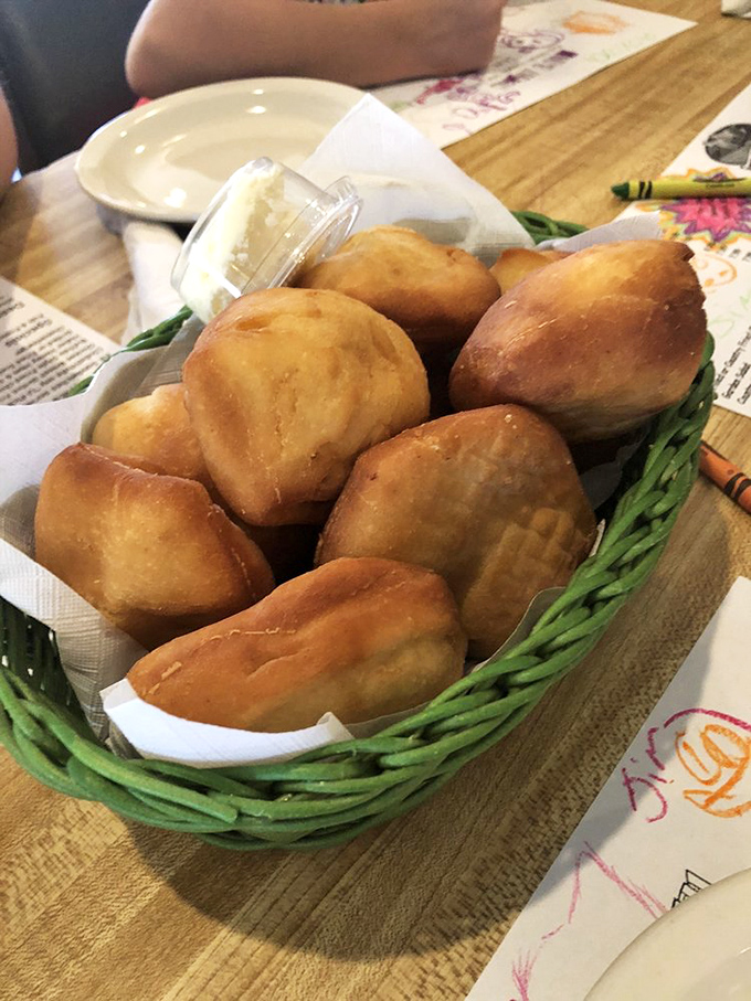 These golden fried biscuits aren't just bread—they're little pouches of joy waiting to be slathered with apple butter and memories.