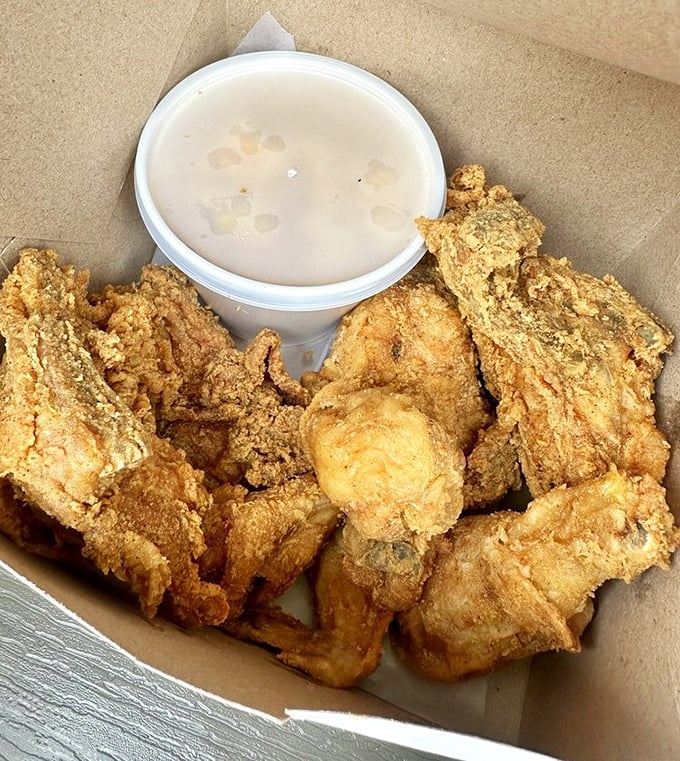 Golden-brown perfection that makes you want to high-five strangers. This fried chicken doesn't just set the bar—it is the bar.