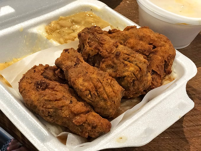 Golden-brown fried chicken with a crust so perfect it deserves its own security detail. The kind that makes you involuntarily close your eyes.