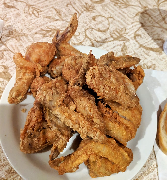 This plate of fried chicken isn't just dinner—it's edible architecture with a golden-brown roof and juicy foundation that would make Colonel Sanders weep with envy.
