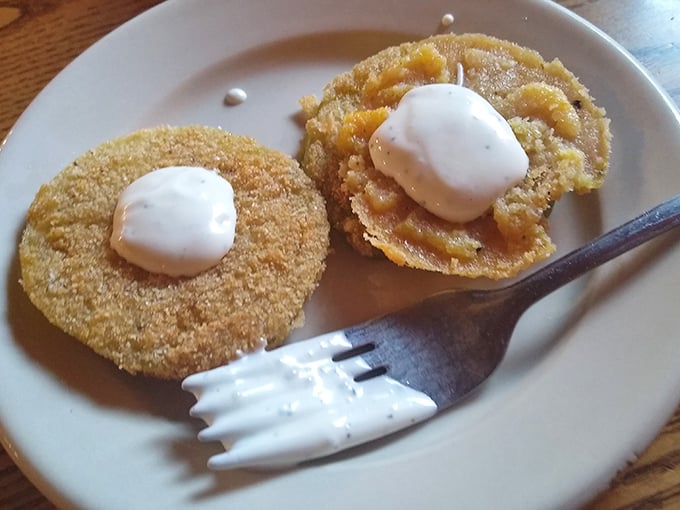 Golden perfection achieved – these fried green tomatoes with their crispy coating and dollop of ranch are worth the drive alone.