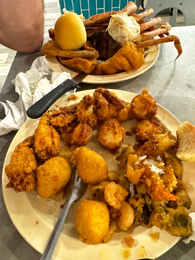 A seafood lover's dream plate: golden-fried delights alongside those magnificent crab legs. This isn't just dinner—it's an expedition requiring proper tools and strategy.
