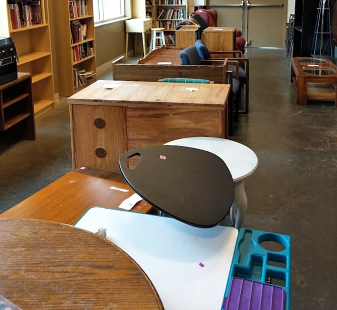 The furniture section—where mid-century modern pieces mingle with practical desks, and every item whispers, "Take me home for less than you'd spend on dinner for two."