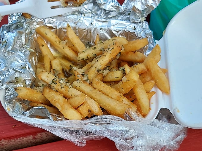 These aren't just garlic fries – they're a religious experience wrapped in foil, glistening with buttery, herbaceous perfection.