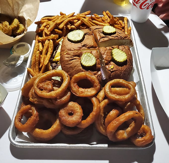 This isn't just a burger—it's an edible monument to excess, complete with a regiment of onion rings standing guard. Your diet doesn't stand a chance.