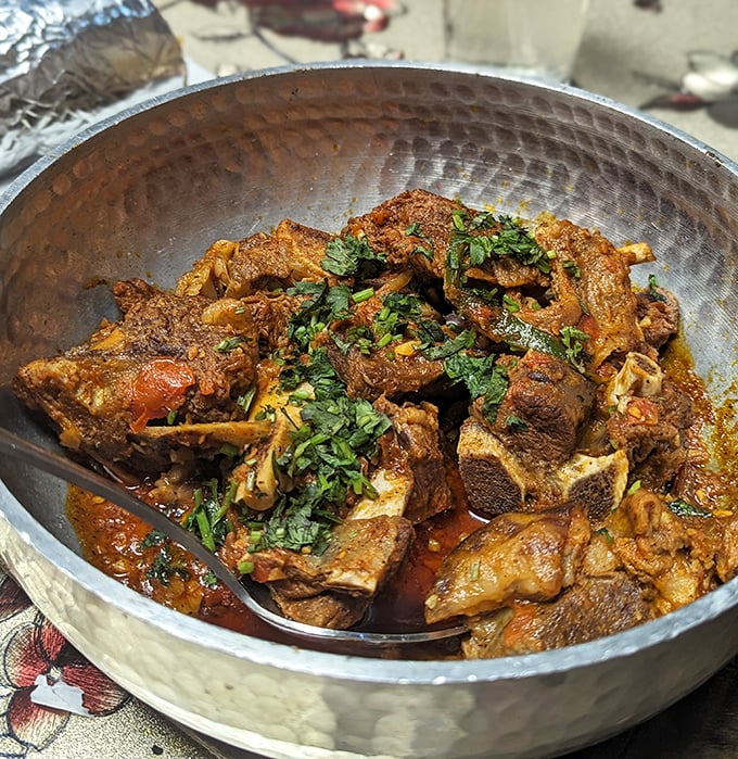 Goat Shinwari in its traditional karahi—tender, spiced, and proof that some cooking vessels are iconic for good reason.