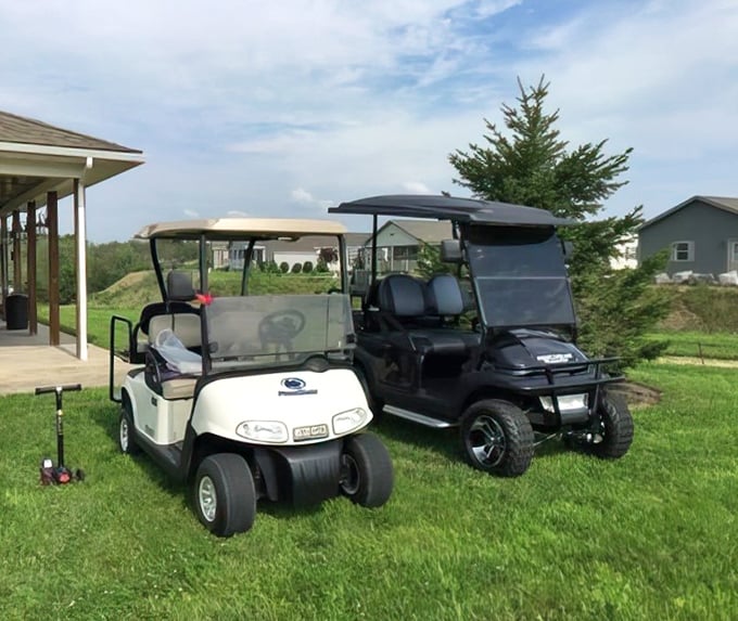 Transportation, retirement style! These golf carts aren't just for the links—they're the community chariots for everything from mailbox runs to neighbor visits.