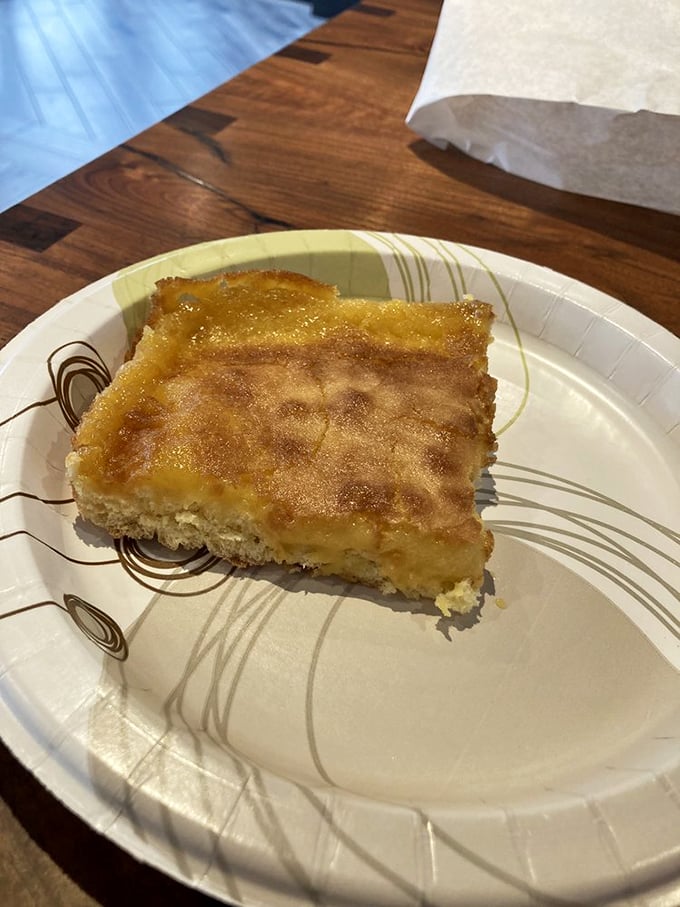Behold the holy grail of St. Louis cuisine—gooey butter cake in its natural habitat. That golden-topped square contains more joy than most wedding ceremonies.
