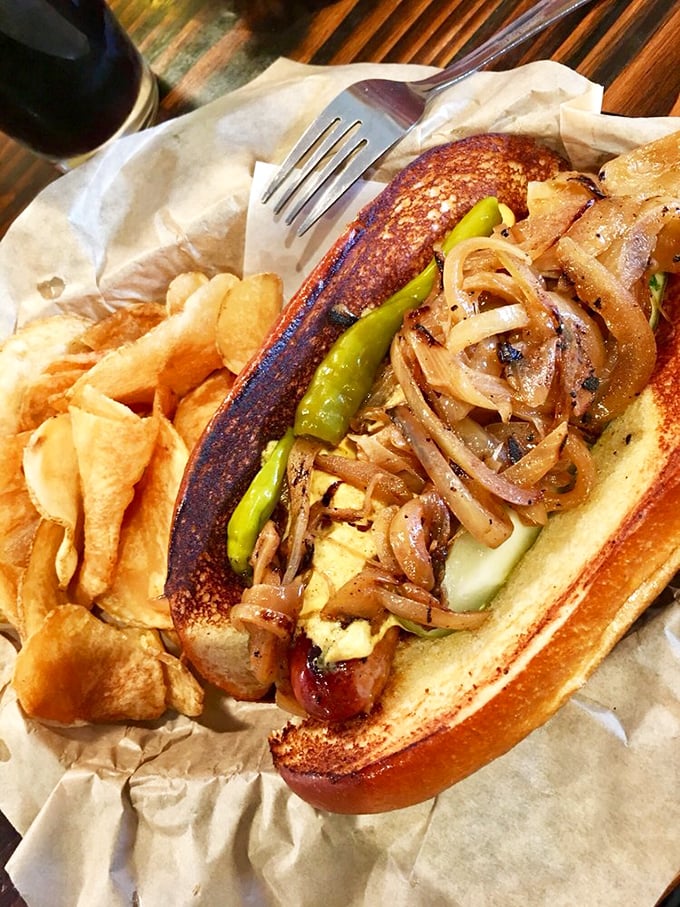 This isn't just a hot dog—it's an architectural masterpiece of caramelized onions, peppers, and perfectly grilled sausage that makes ketchup seem like finger painting next to fine art.