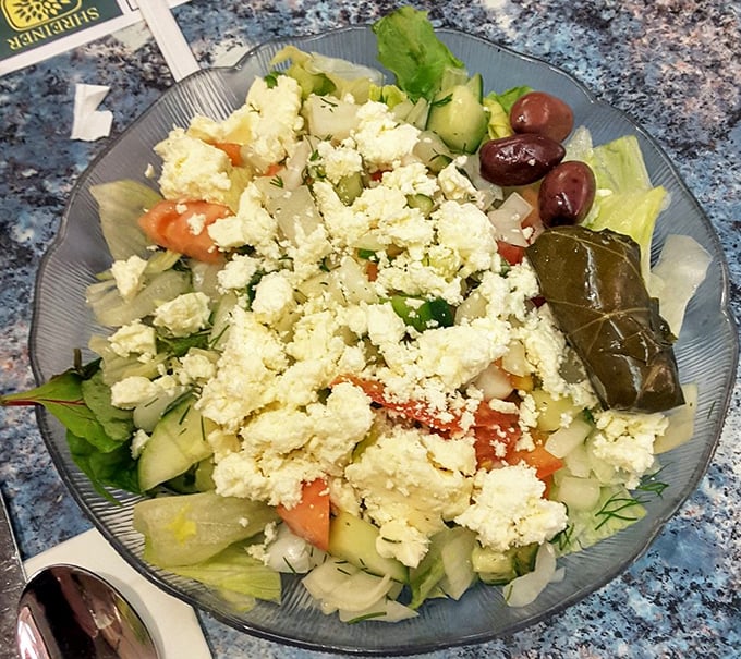This Greek salad isn't just playing in the big leagues—it's the MVP, with feta cheese that's traveled further to get here than most of us did.