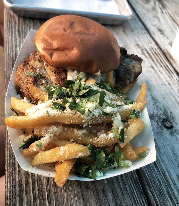 The star of the show in all its glory! This blackened grouper sandwich with herb-dusted fries isn't just a meal—it's a Florida rite of passage.