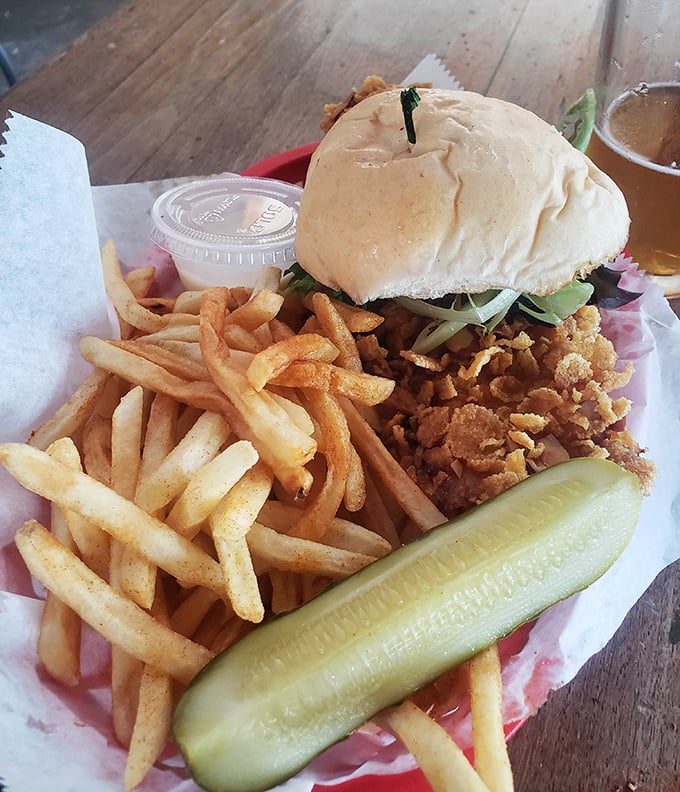 The star of the show in all its golden-fried glory. That pickle isn't just garnish—it's the exclamation point at the end of a perfect culinary sentence.