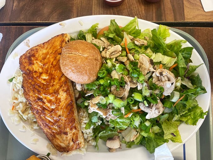 Perfectly grilled fish meets fresh salad in a plate that screams California coastal cuisine. That golden sear is what fish dreams are made of.
